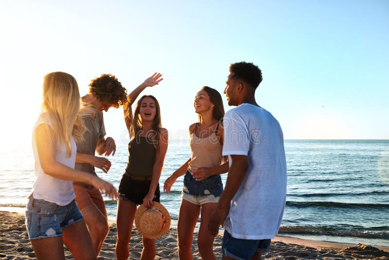 Group of Friends Dancing on the Beach Stock Image - Image of ...