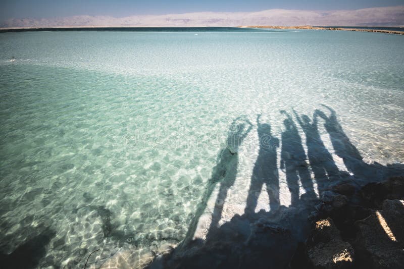 Group Friends Dead Sea Israel Stock Photo - Image of shadow, waving ...