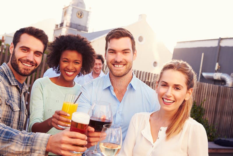 Group of Friends Drinking at a Rooftop Bar Stock Photo - Image of ...