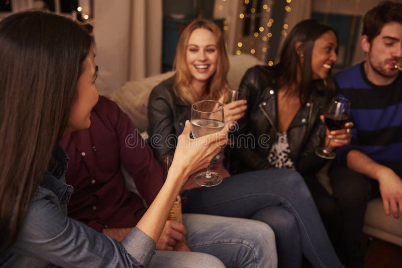 Group of Friends with Drinks Enjoying House Party Together Stock Photo ...