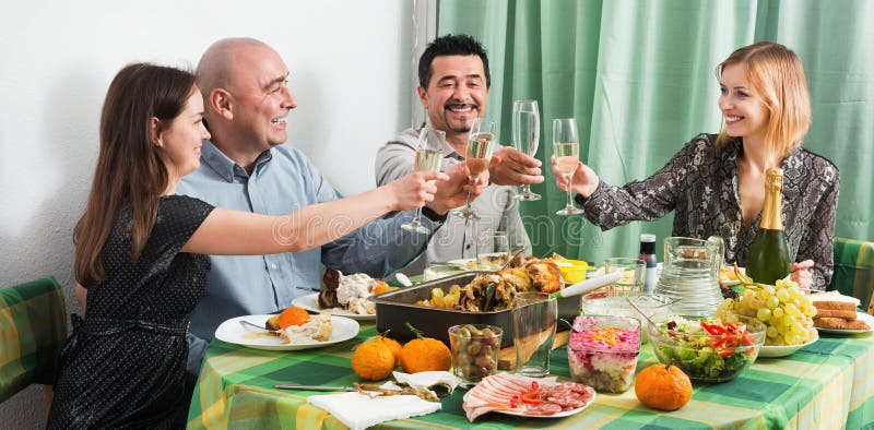 Group of Friends Eating at Festive Table Stock Image - Image of ...