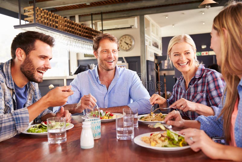 Attractive Group Eating at Restaurant, Stock Image - Image of cuisine ...
