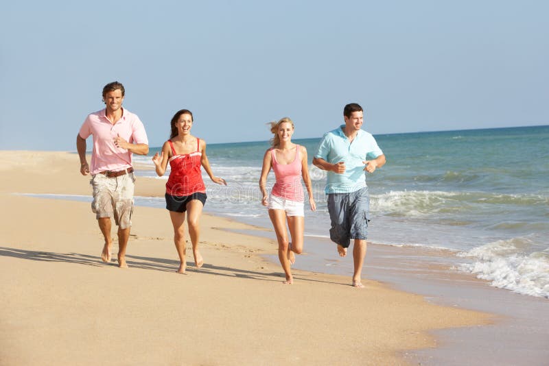 Group of Friends Enjoying Beach Holiday in the Sun Stock Image - Image ...