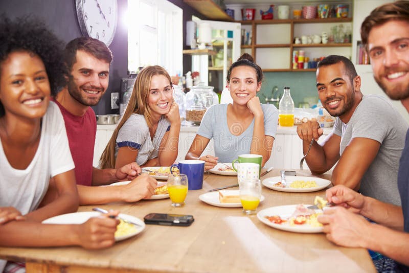 Group of Friends Enjoying Breakfast in Kitchen Together Stock Image ...