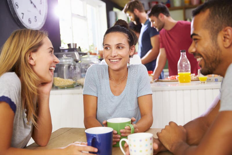 Group of Friends Enjoying Breakfast in Kitchen Together Stock Photo ...