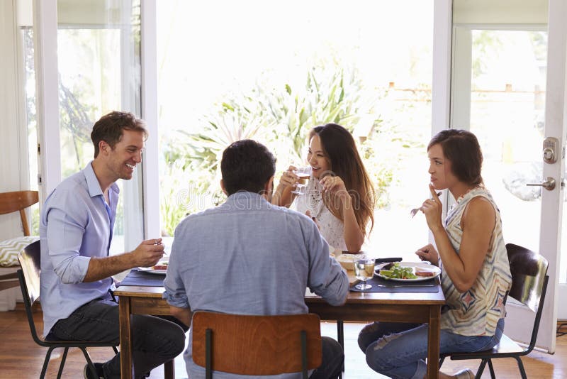 Group of Friends Enjoying Dinner Party at Home Together Stock Image ...