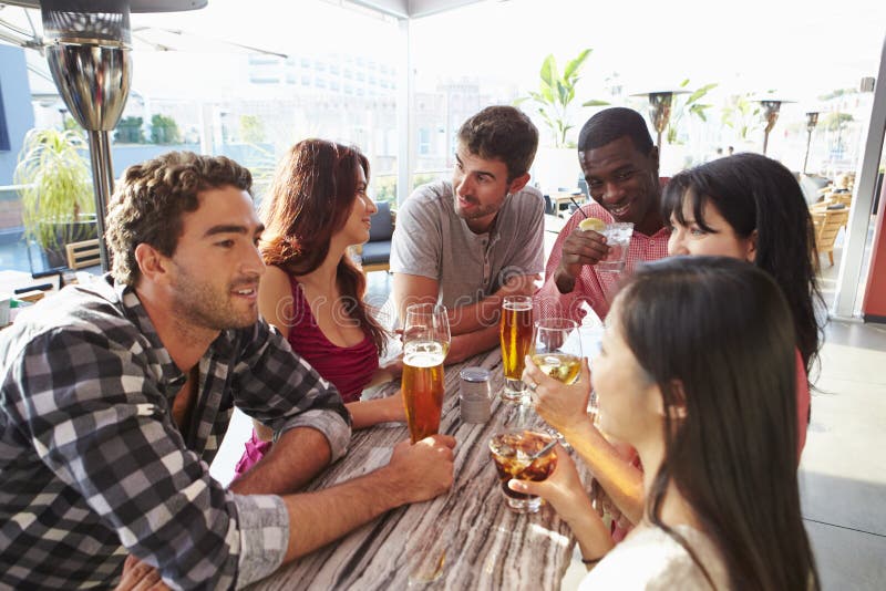 Group of Friends Enjoying Drink at Outdoor Rooftop Bar Stock Image ...