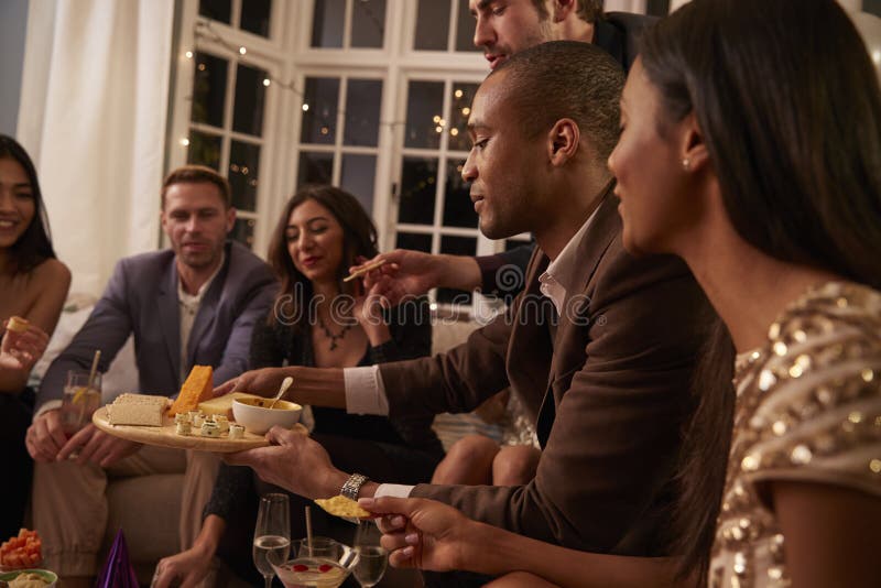 Group of Friends Enjoying Drinks and Snacks at Party Stock Image ... Group of Friends Enjoying Drinks and Snacks at Party Stock Image ...