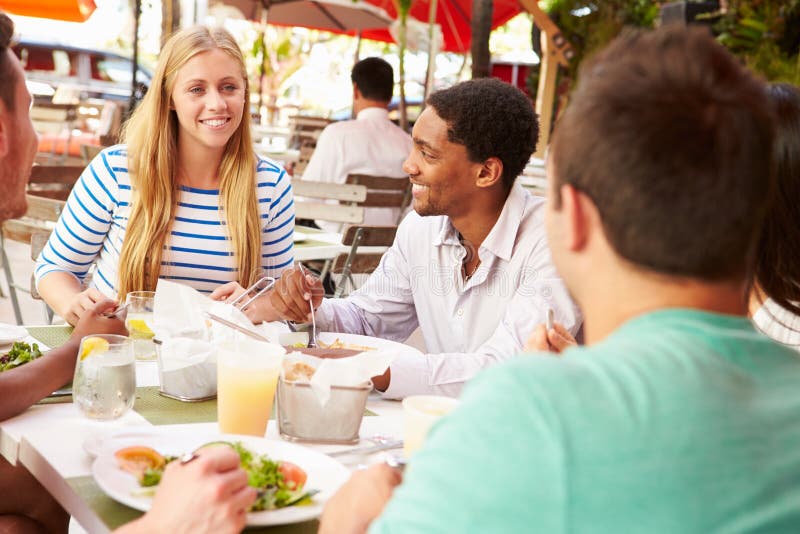 Group of Friends Enjoying Lunch in Outdoor Restaurant Stock Photo ...