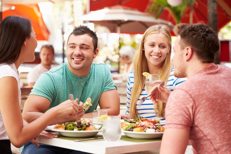 Group of Friends Enjoying Lunch in Outdoor Restaurant Stock Photo ...