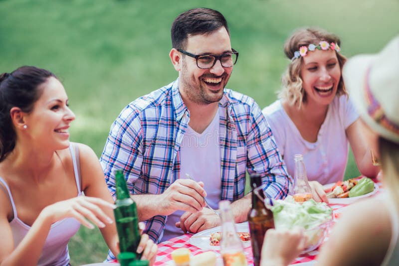 Friends Enjoying a Lunch Time Together in the Nature Stock Image ...
