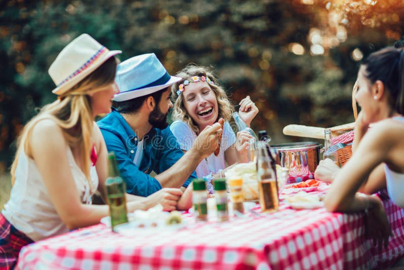 Friends Enjoying a Lunch Time Together in the Nature Stock Image ...
