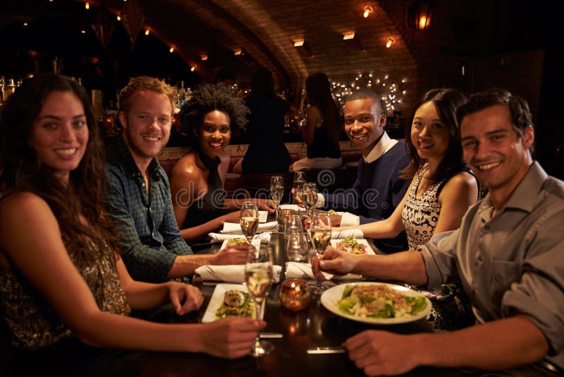 Group of Friends Enjoying Meal in Restaurant Stock Photo - Image of ...