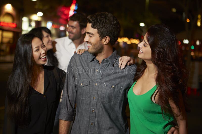 Group of Friends Enjoying Night Out Together Stock Image - Image of ...