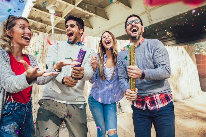 Friends Enjoying Party and Throwing Confetti. Stock Image - Image of ...