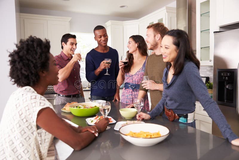Group of Friends Enjoying Pre Dinner Drinks at Home Stock Image - Image ...