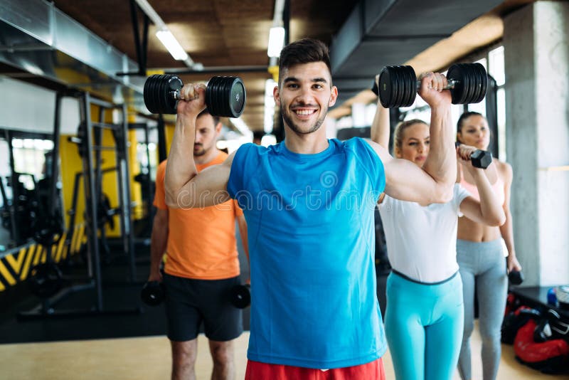 Group of Friends Exercising Together in Gym Stock Photo - Image of ...