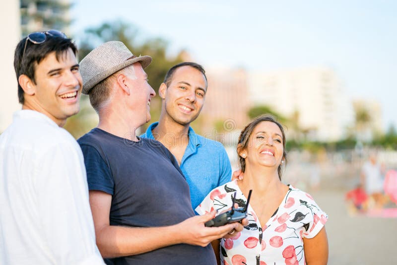 Friends Flying Drone Together - Group of Two Guys Having Fun Playing ...