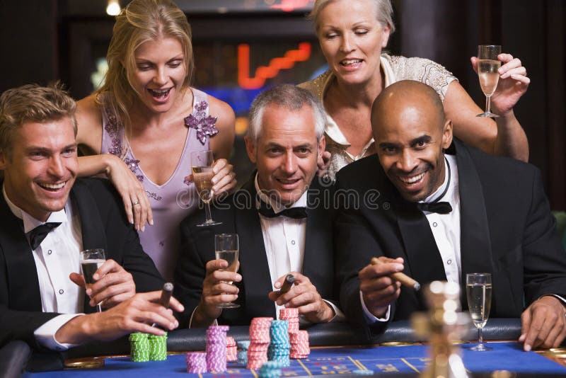 Group of Friends Gambling at Roulette Table Stock Image - Image of ...