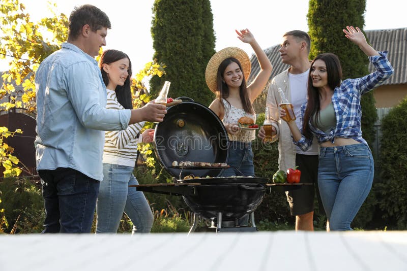 Group of Friends Having Barbecue Party Outdoors Stock Image - Image of ...