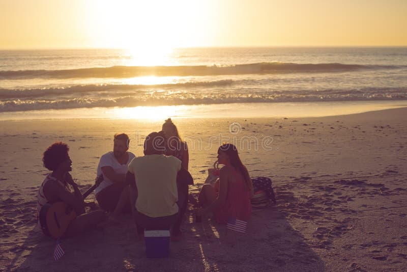 Group of Friends Having Fun at Beach during Sunset Stock Image - Image ...