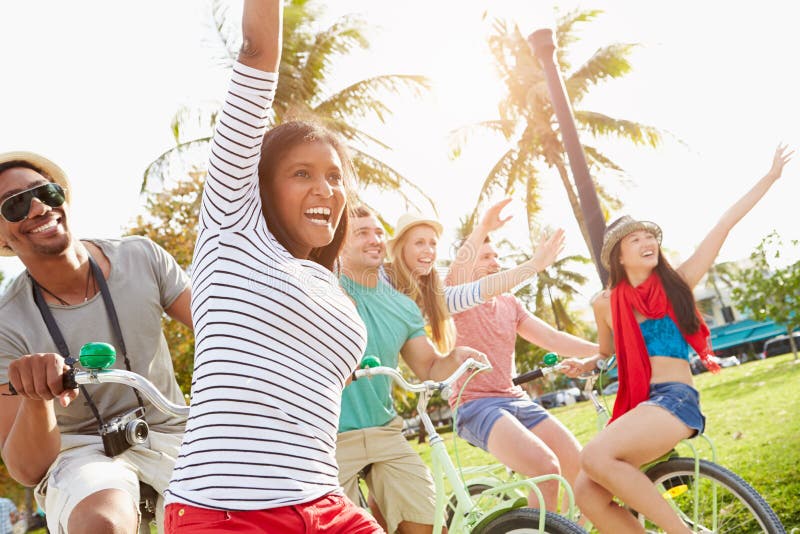 Group of Friends Having Fun on Bicycle Ride Stock Photo - Image of ...