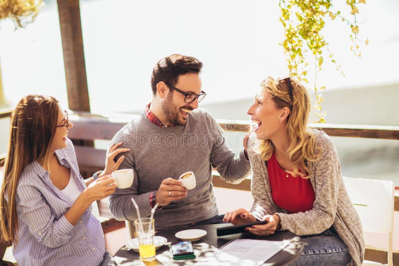 Group of Friends Having Fun in Cafe, Using Digital Tablet Stock Image ...