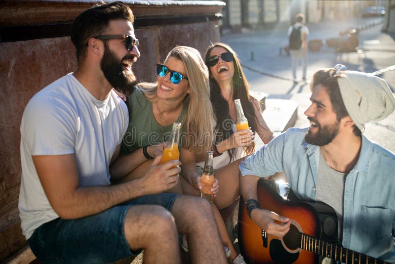 Group of Friends Having Fun and Hanging Out Outdoors Stock Photo ...