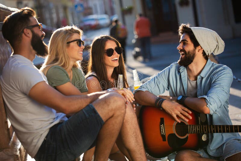 Group of Friends Having Fun and Hanging Out Outdoors Stock Photo ...