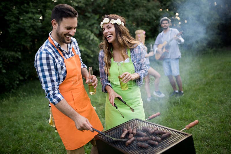 People Concept - Friends Having a Barbecue Party in Nature while Having ...