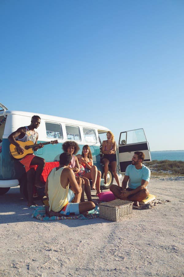 Group of Friends Having Fun Near Camper Van at Beach Stock Image ...