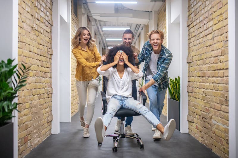 Group of Friends Having Fun in the Office Corridor after a Nice Day ...
