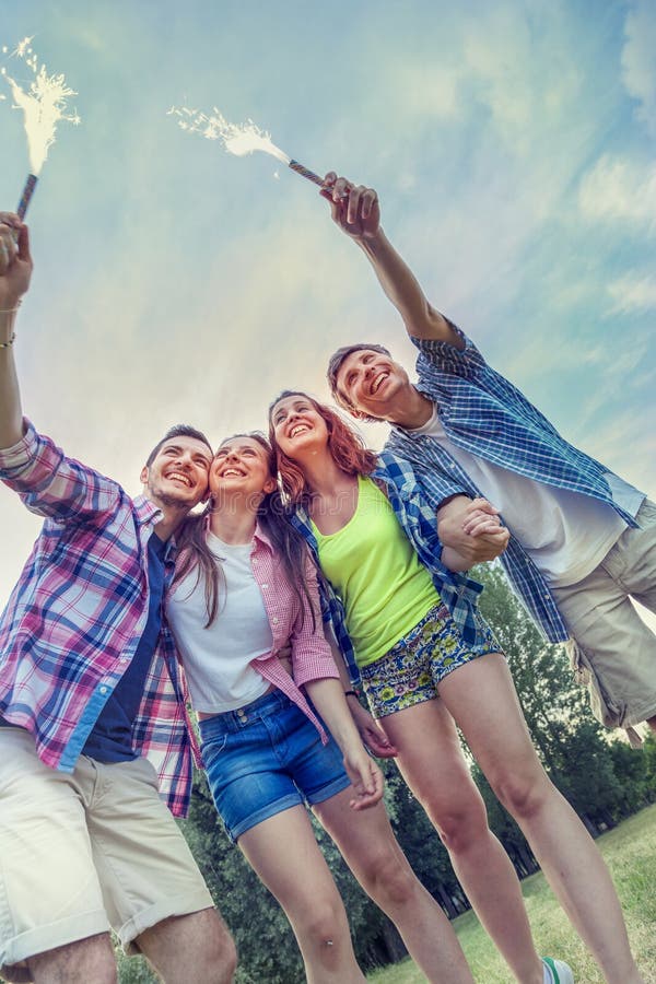 Group of Friends Having Fun Outdoors on a Summer Sunset Stock Photo ...