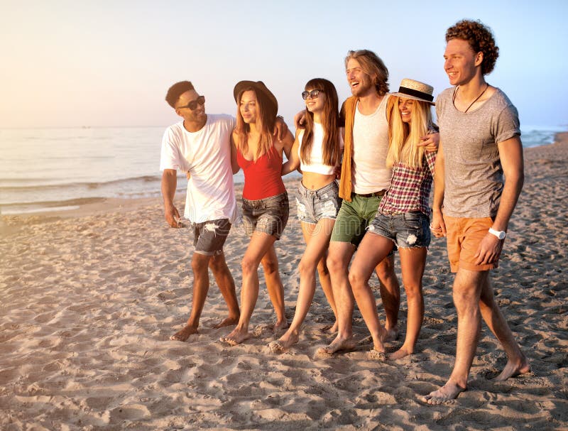 Group of Friends Having Fun on the Beach Stock Image - Image of sand ...