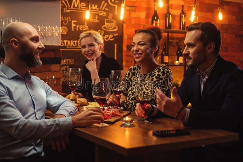 Group of Friends Having Fun Talk Behind Bar Counter in a Cafe Stock ...