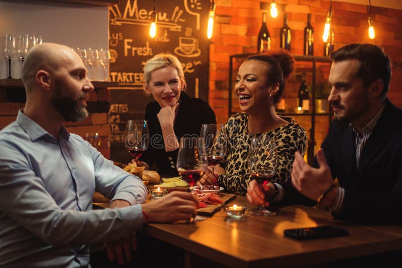 Group of Friends Having Fun Talk Behind Bar Counter in a Cafe Stock ...