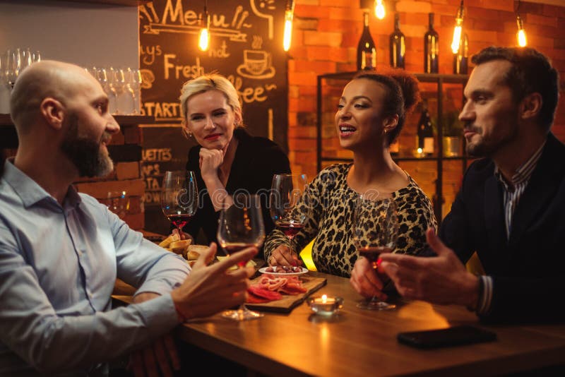 Group of Friends Having Fun Talk Behind Bar Counter in a Cafe Stock ...