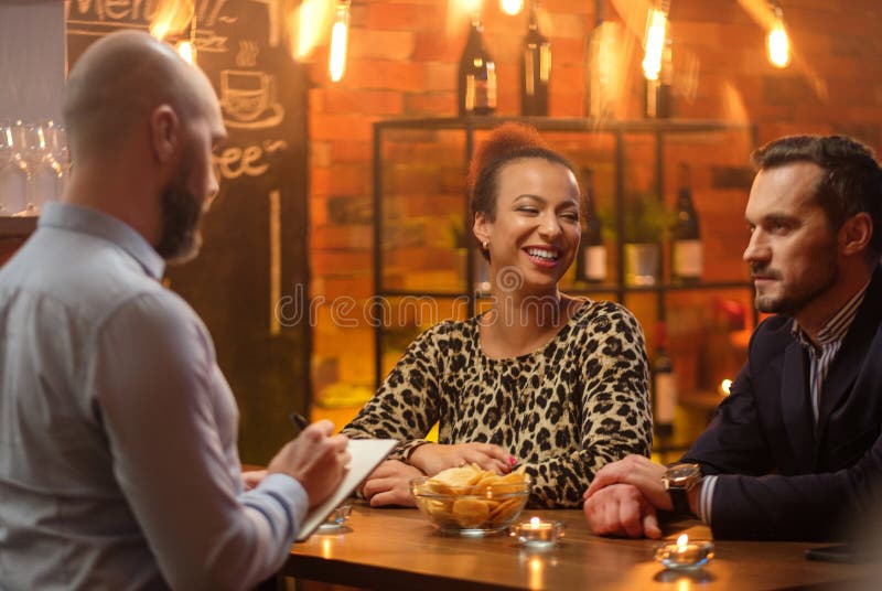 Group of Friends Having Fun Talk Behind Bar Counter in a Cafe Stock ...
