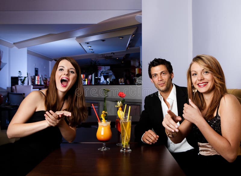 Ordering drinks at the bar stock photo. Image of dressed - 16208968