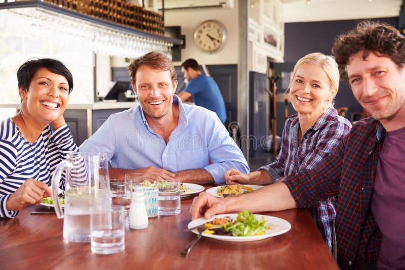 A Group of Friends Having Lunch in a Restaurant Stock Image - Image of ...