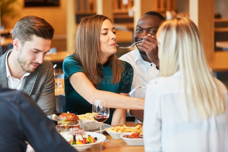 Group of Friends Having Lunch Together Stock Image - Image of local ...