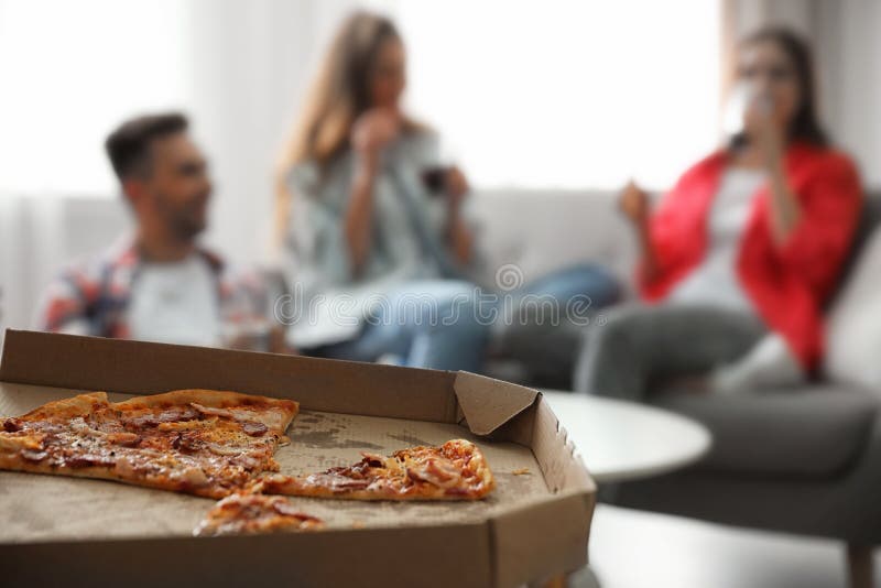 Group of Friends Having Party, Focus on Pizza Stock Photo - Image of ...