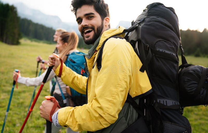 Group of Friends Hiking Together Outdoors Exploring the Wilderness and ...