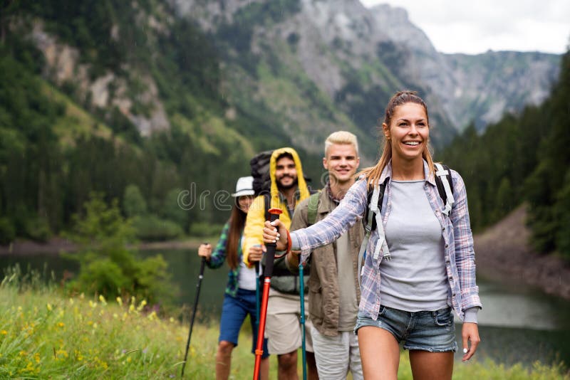 Group of Friends Hiking Together Outdoors Exploring the Wilderness and ...