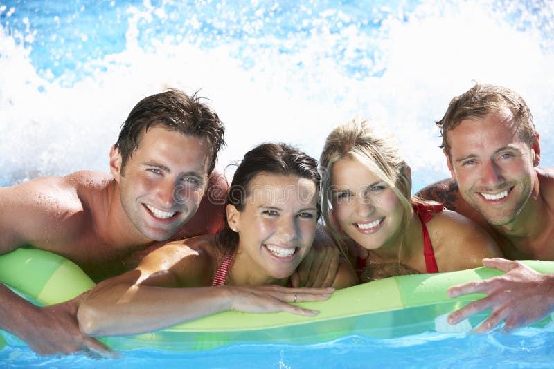 Group of Friends on Holiday in Swimming Pool Stock Photo - Image of ...