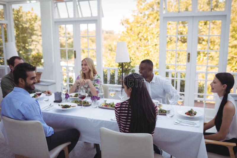 Group of Friends Interacting with Each Other while Having Lunch ...