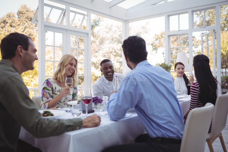 Group of Friends Interacting with Each Other while Having Lunch ...