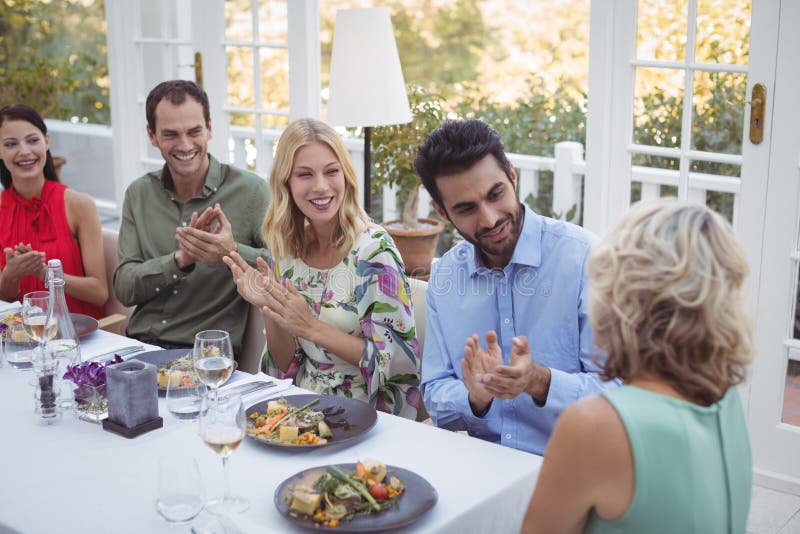 Group of Friends Interacting with Each Other while Having Meal Together ...