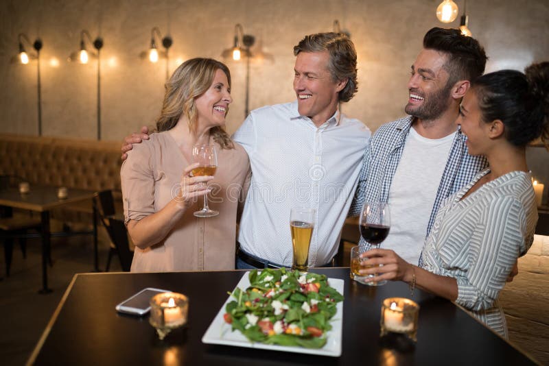 Group of Friends Interacting with Each Other Stock Photo - Image of ...