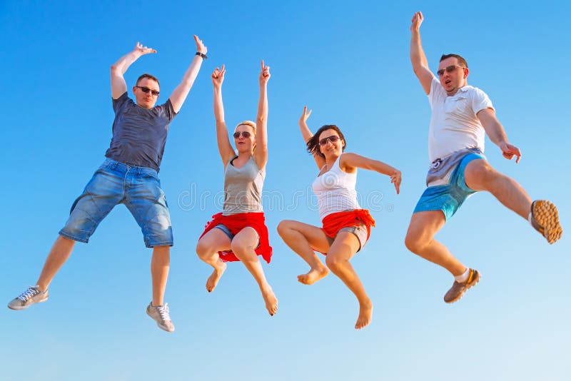 Image of Young People Jumping Together Outdoor. Stock Photo - Image of ...